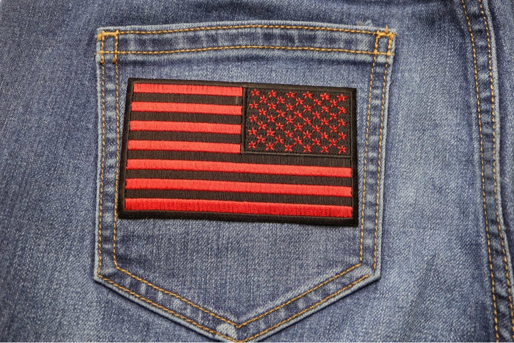 Black and Red Reversed American Flag Patch 4 Inch shown on jeans