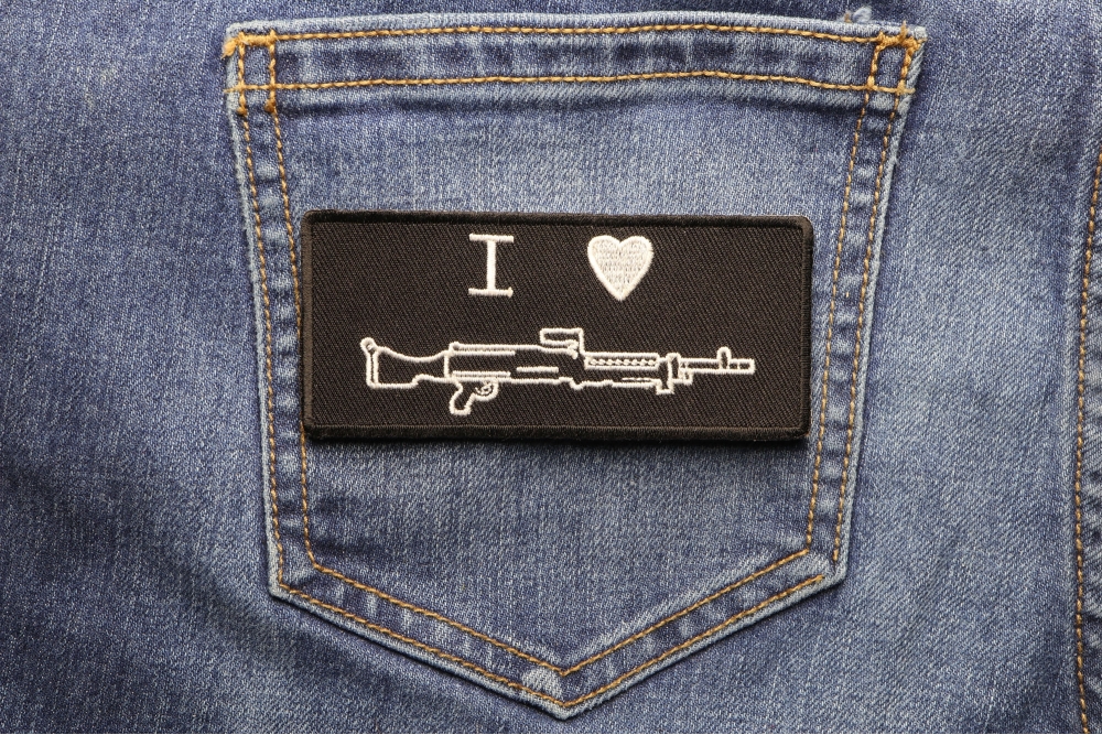 I Heart Machine Gun Patch shown on jeans