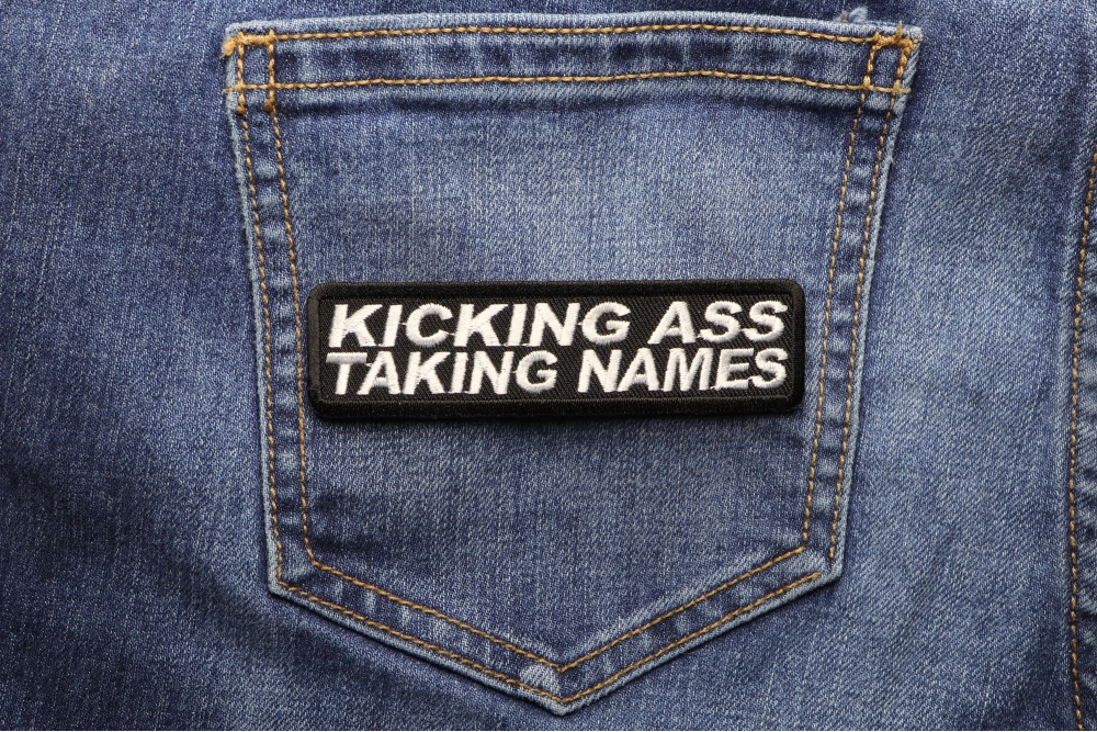 Kicking Ass Taking Names Patch shown on jeans