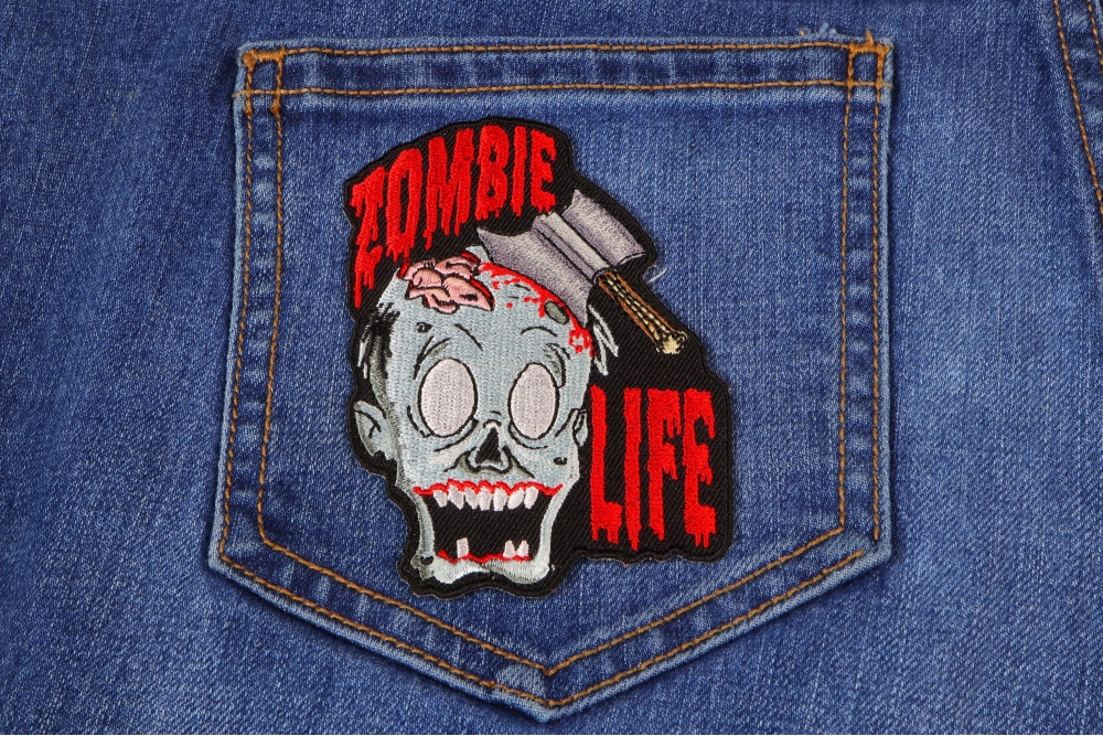 Zombie Life Small Patch With Axed Zombie shown on jeans