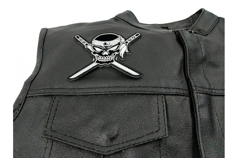 Small Skull Cross Swords Patch - Iron on Patch - 4x3.5 inch shown on leather vest