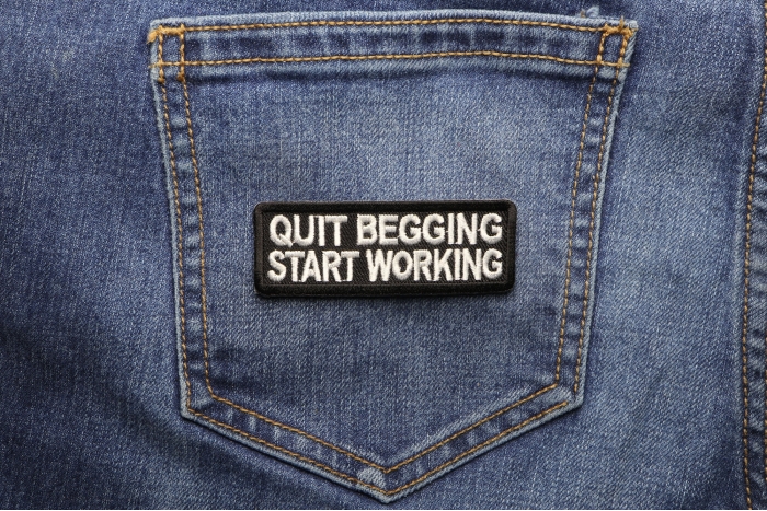Quit Begging Start Working Patch shown on jeans