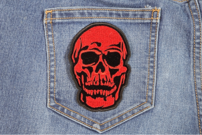 Small Red Baron Skull Patch shown on jeans
